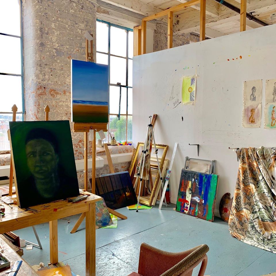 Artist Painting In Studio